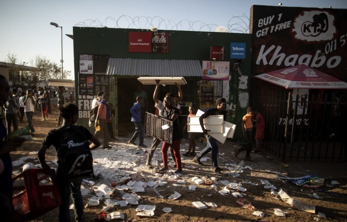 Dozens arrested and goods recovered in aftermath of Soweto violence ...
