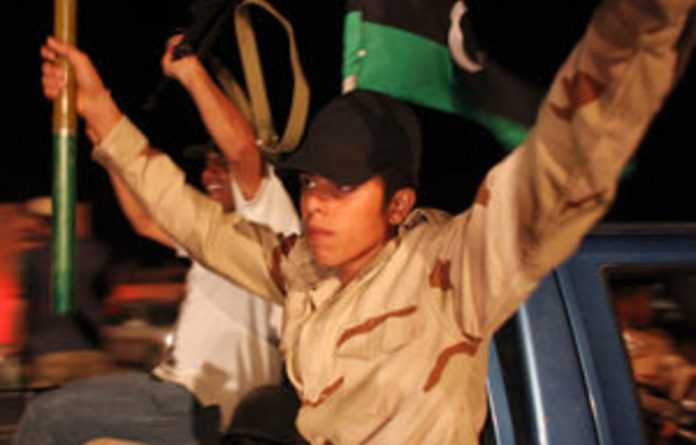 Libya fighters surround pro-Gaddafi town – The Mail & Guardian